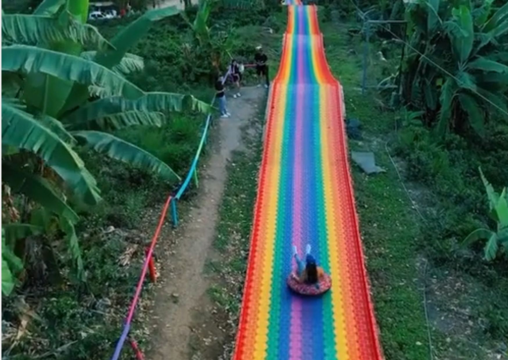 Colombia's rainbow waterslide: The world's longest plastic slide takes ...