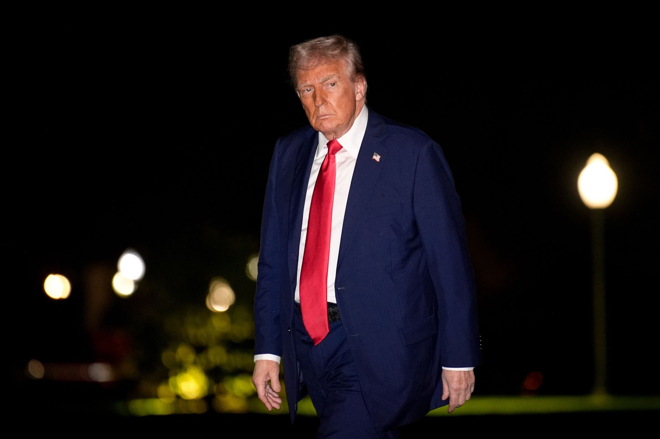 Trump hints at third presidential run, stirs legal debate